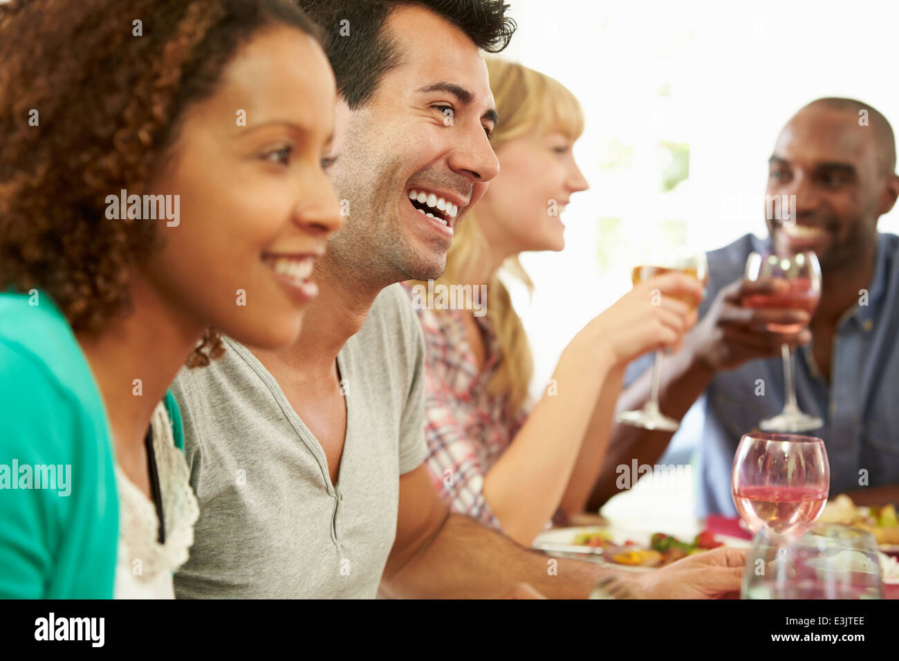Group people sitting around table hi-res stock photography and images ...