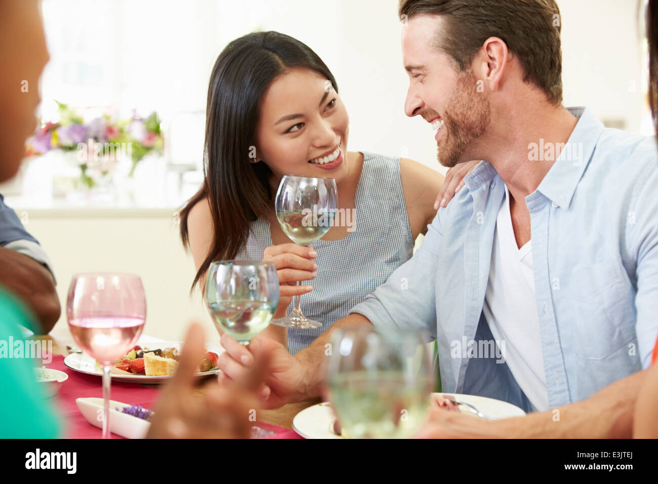 Smiling friends having drink together hi-res stock photography and ...