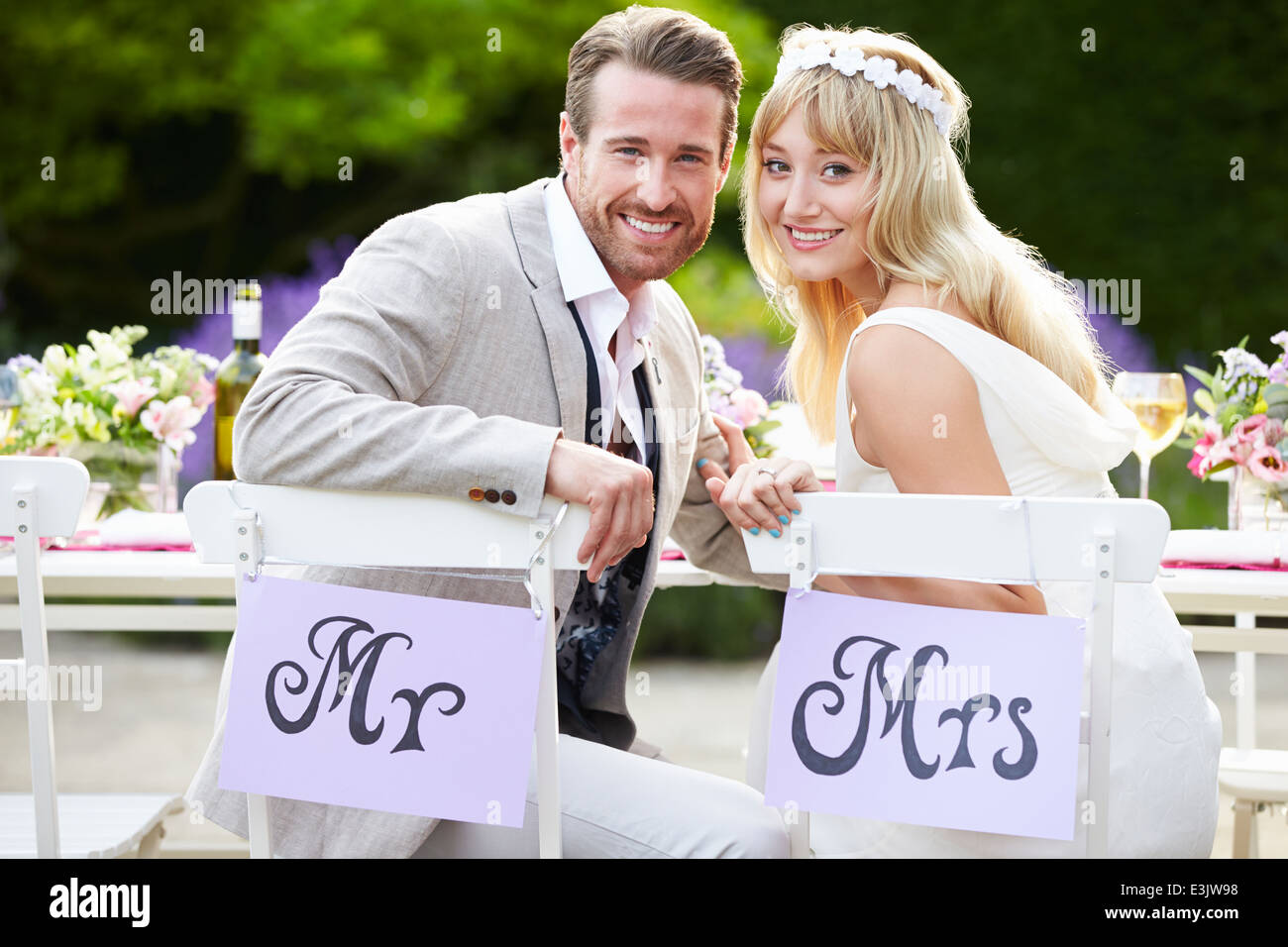 Bride And Groom Enjoying Meal At Wedding Reception Stock Photo - Alamy