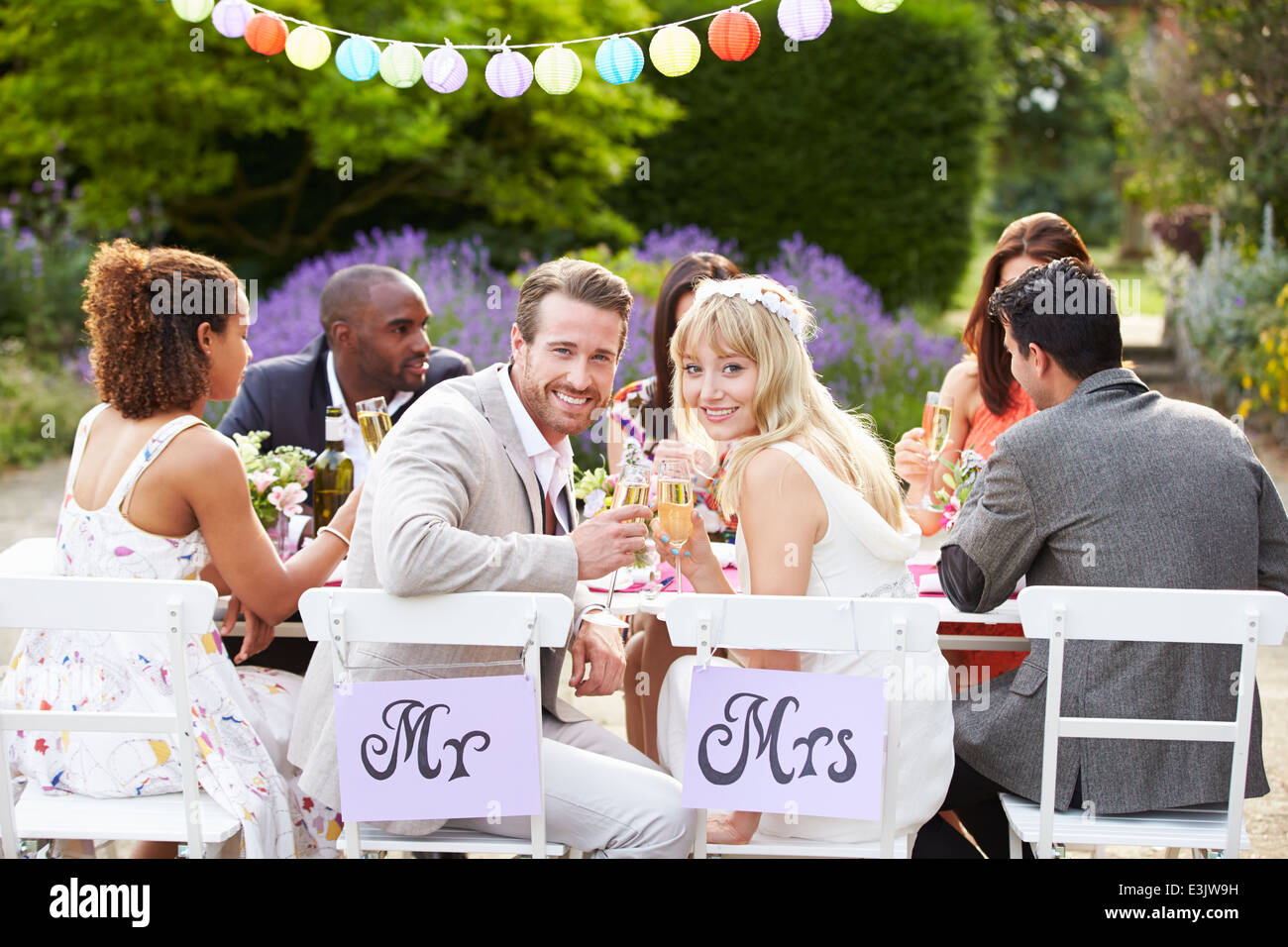 Bride And Groom Enjoying Meal At Wedding Reception Stock Photo - Alamy