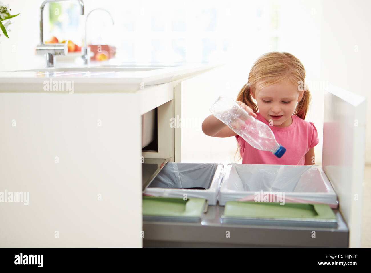 Girl Recycling Kitchen Waste In Bin Stock Photo - Alamy