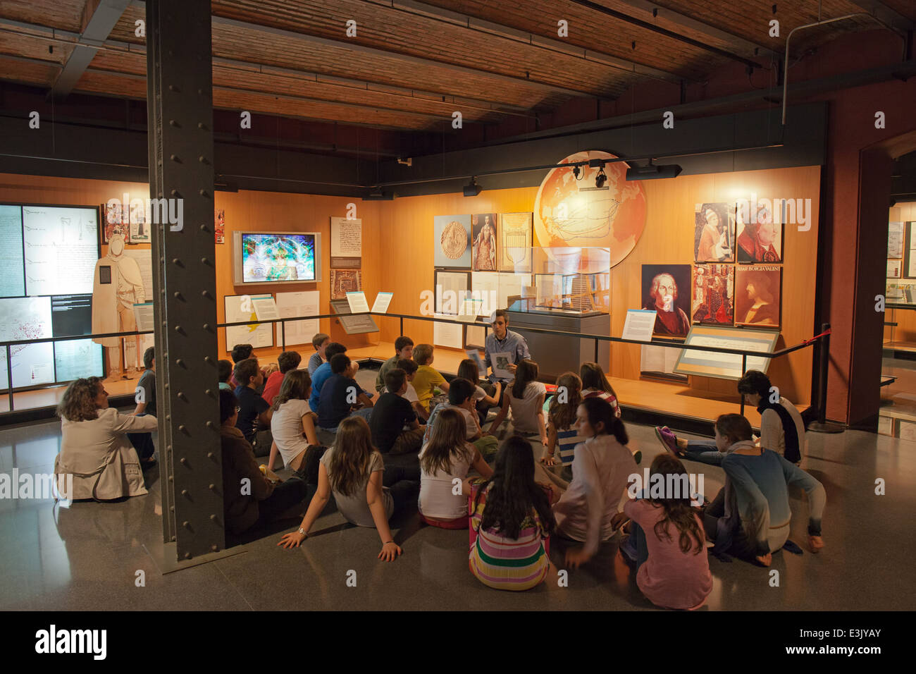 Group of school children listening to lecture on sightseeing tour in ...