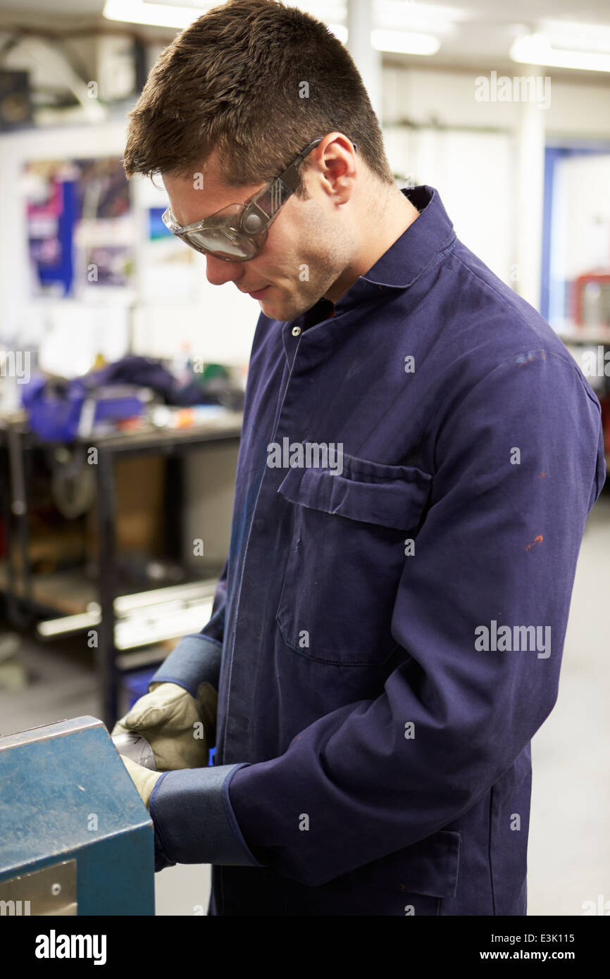 Apprentice Engineer Working On Factory Floor Stock Photo - Alamy