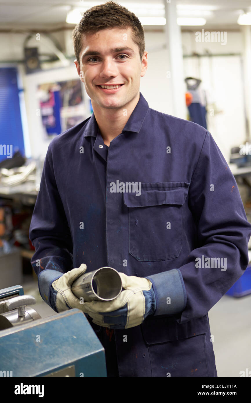 Apprentice Engineer Working On Factory Floor Stock Photo - Alamy