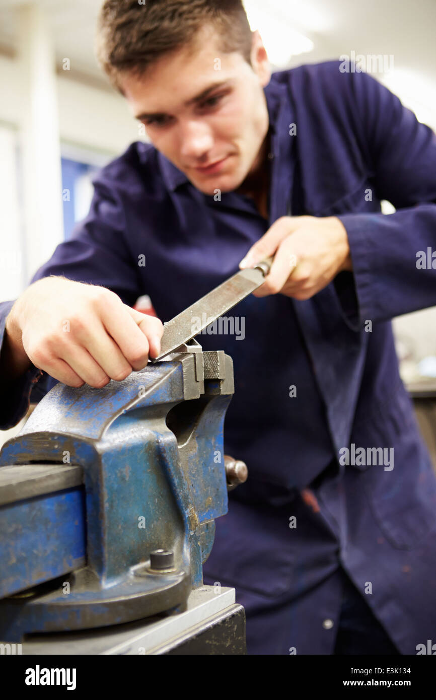 Apprentice Engineer Working On Factory Floor Stock Photo - Alamy