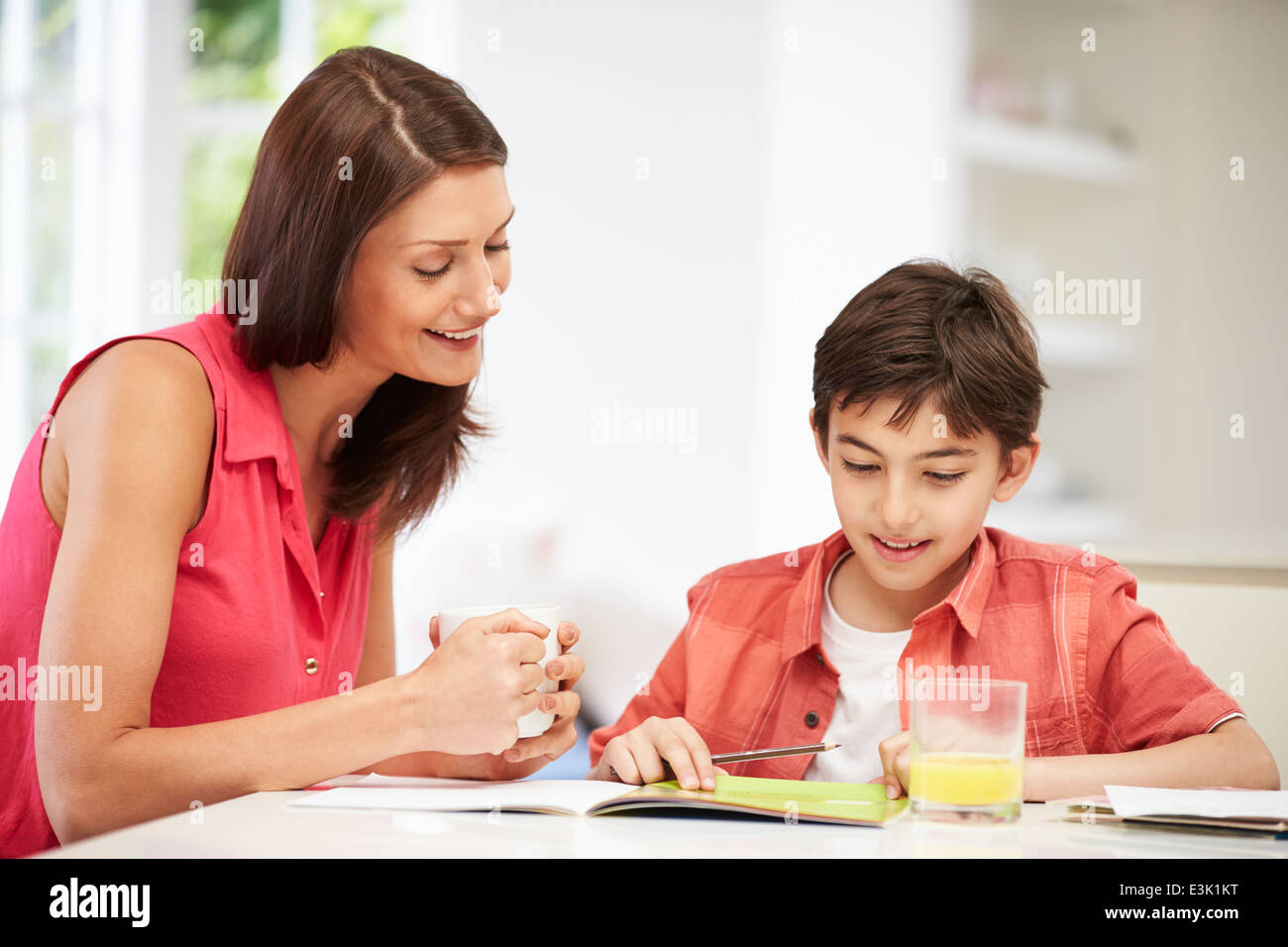 Mother Helping Son With Homework Stock Photo - Alamy Mother Helping Son With Homework Stock Photo - Alamy