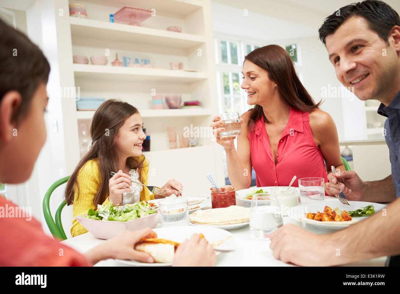 Happy Hispanic Family Eating