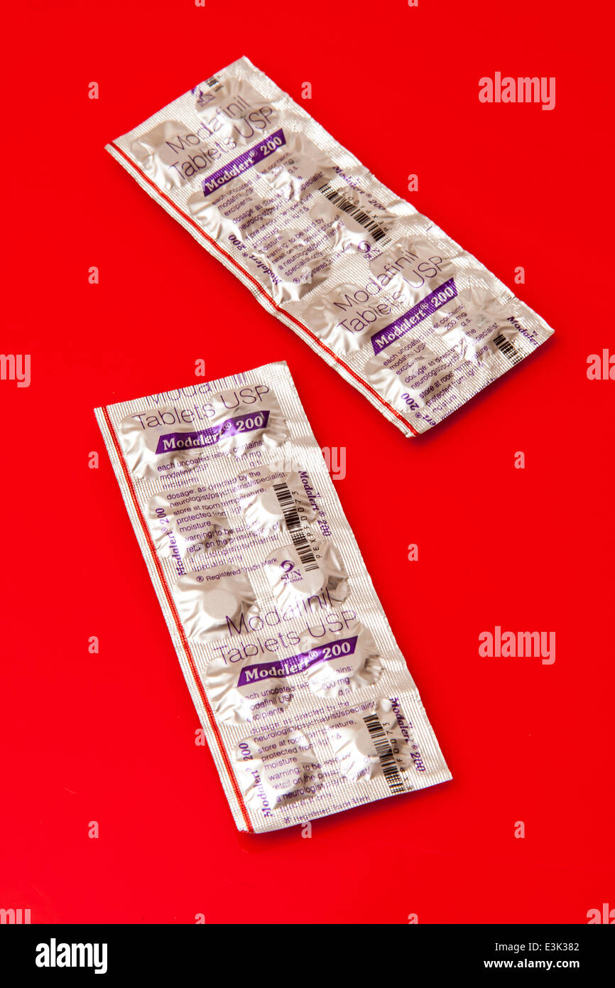 Modafinil, Modalet 200 tablets or pills on a bright red background ...