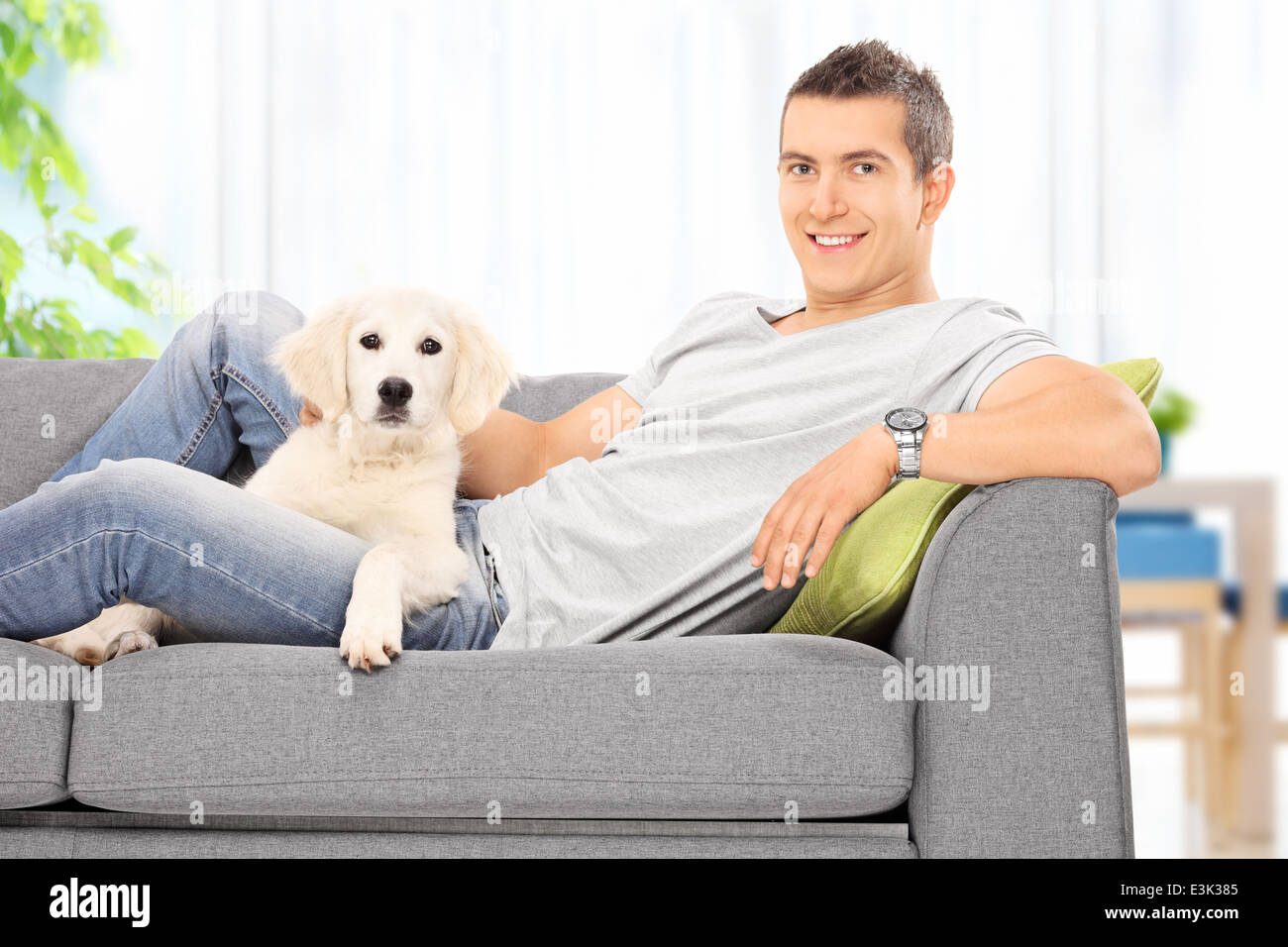 Happy guy with dog hi-res stock photography and images - Alamy