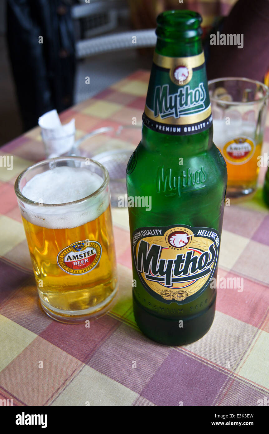 A glass of Mythos Greek beer on a bar on Kos, Greece Stock Photo - Alamy