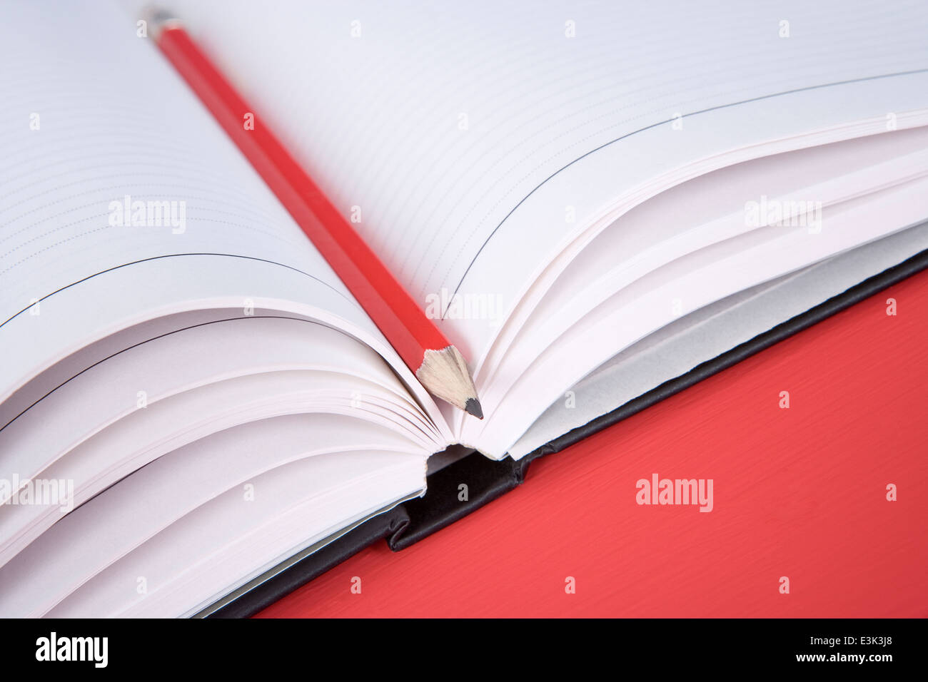 Pencil and notebook, close-up Stock Photo - Alamy
