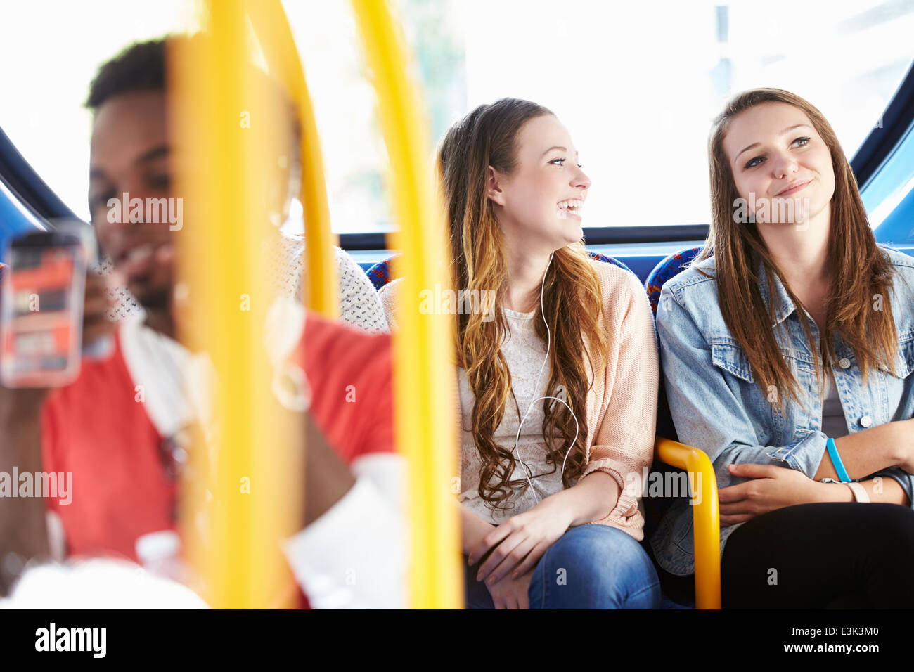 Two Young Women On Bus Journey Together Stock Photo - Alamy