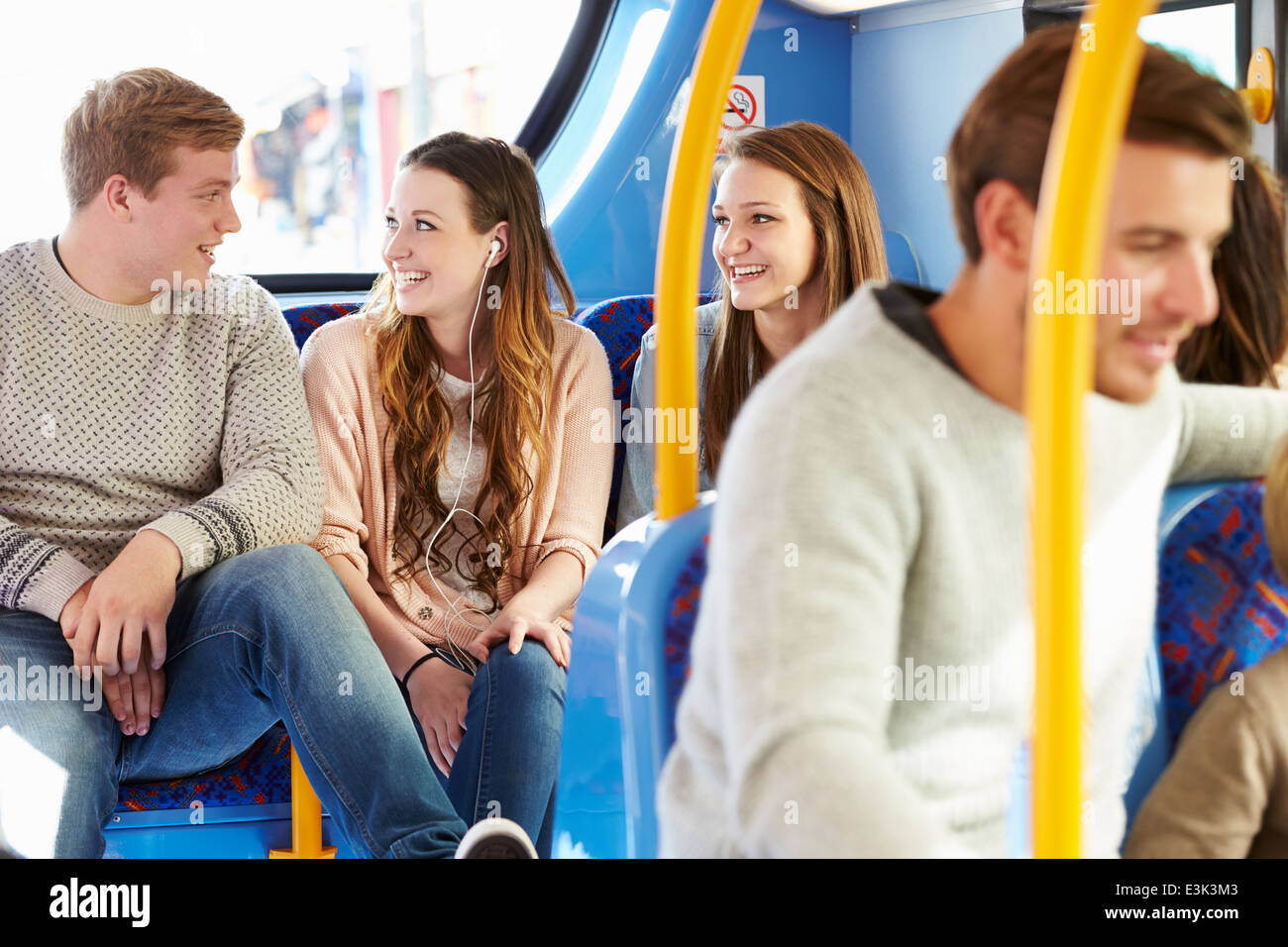 Group Of Young People On Bus Journey Together Stock Photo - Alamy