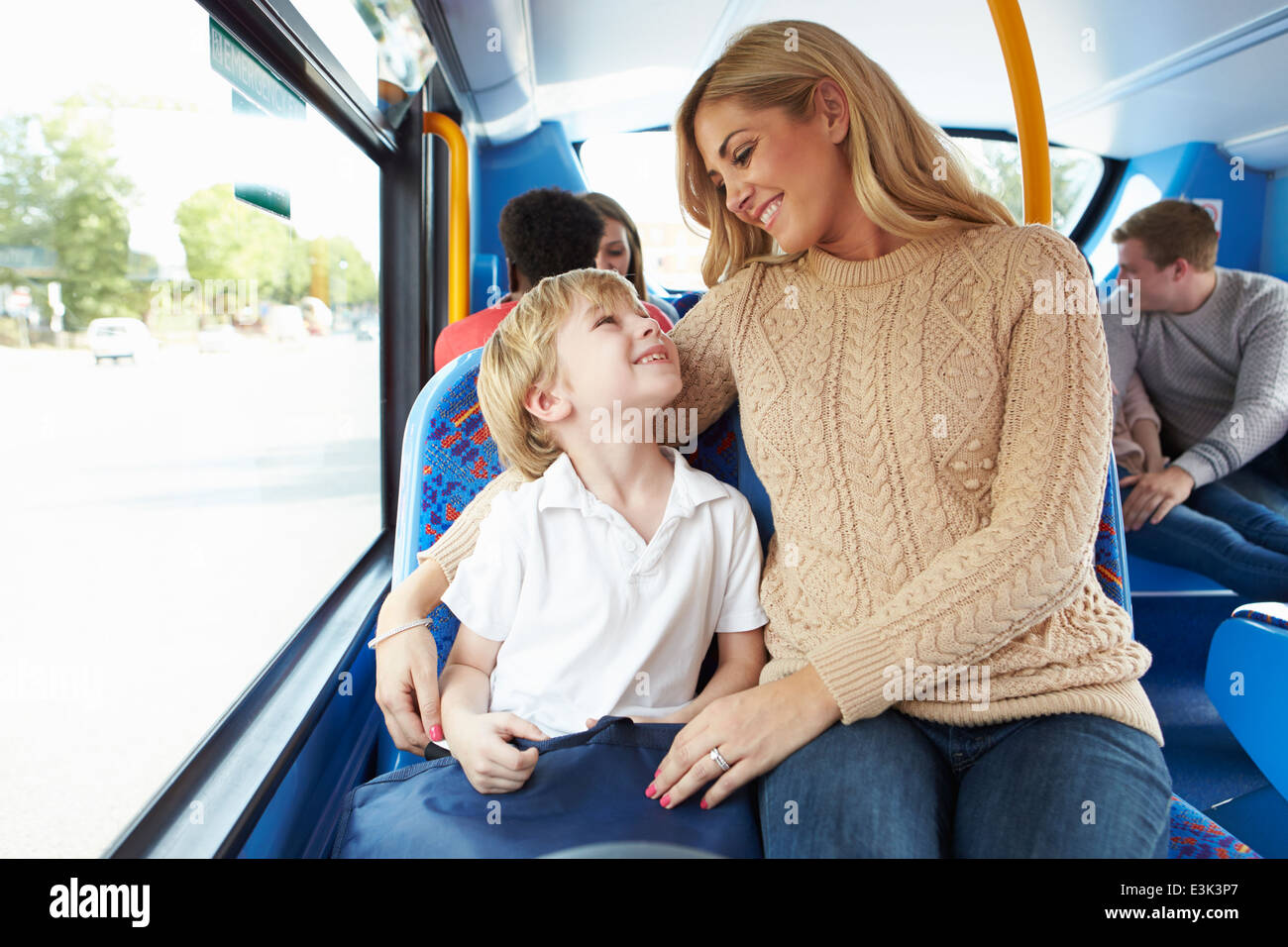 Mother And Son Going To School On Bus Together Stock Photo - Alamy