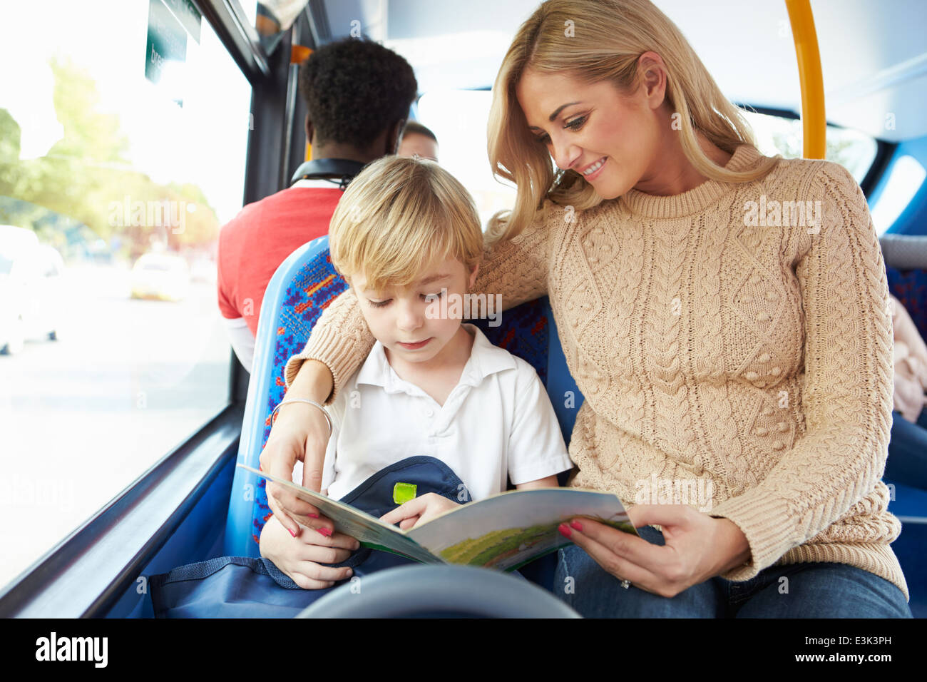 Mother And Son Going To School On Bus Together Stock Photo - Alamy
