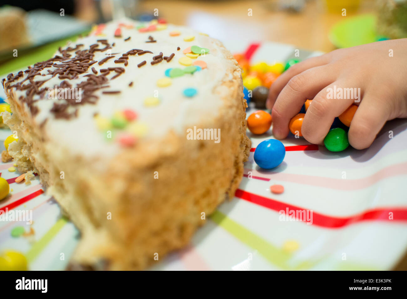 birthday cake and hand Stock Photo - Alamy