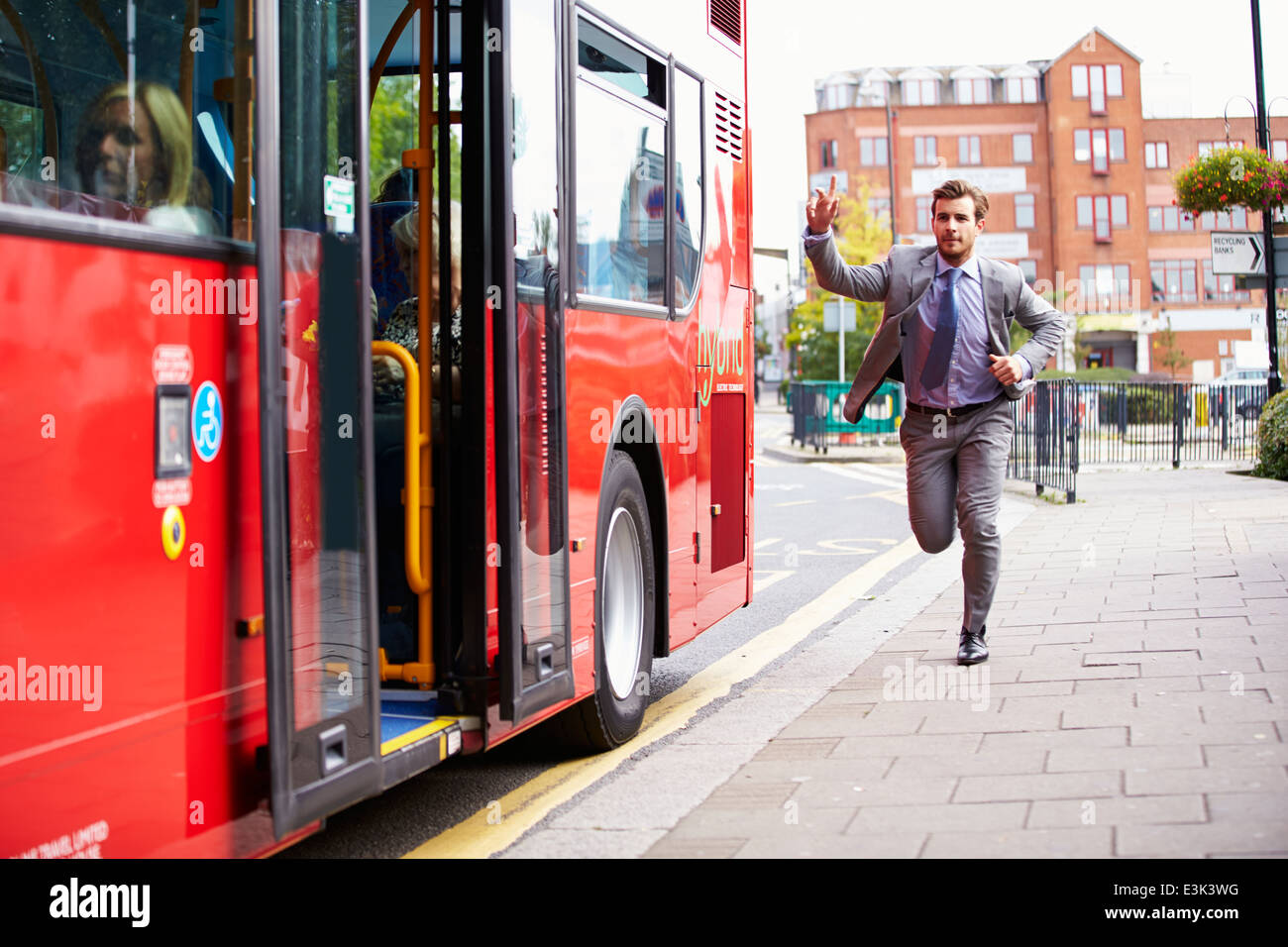 Businessman Running To Catch Bus Stop Stock Photo - Alamy Businessman Running To Catch Bus Stop Stock Photo - Alamy