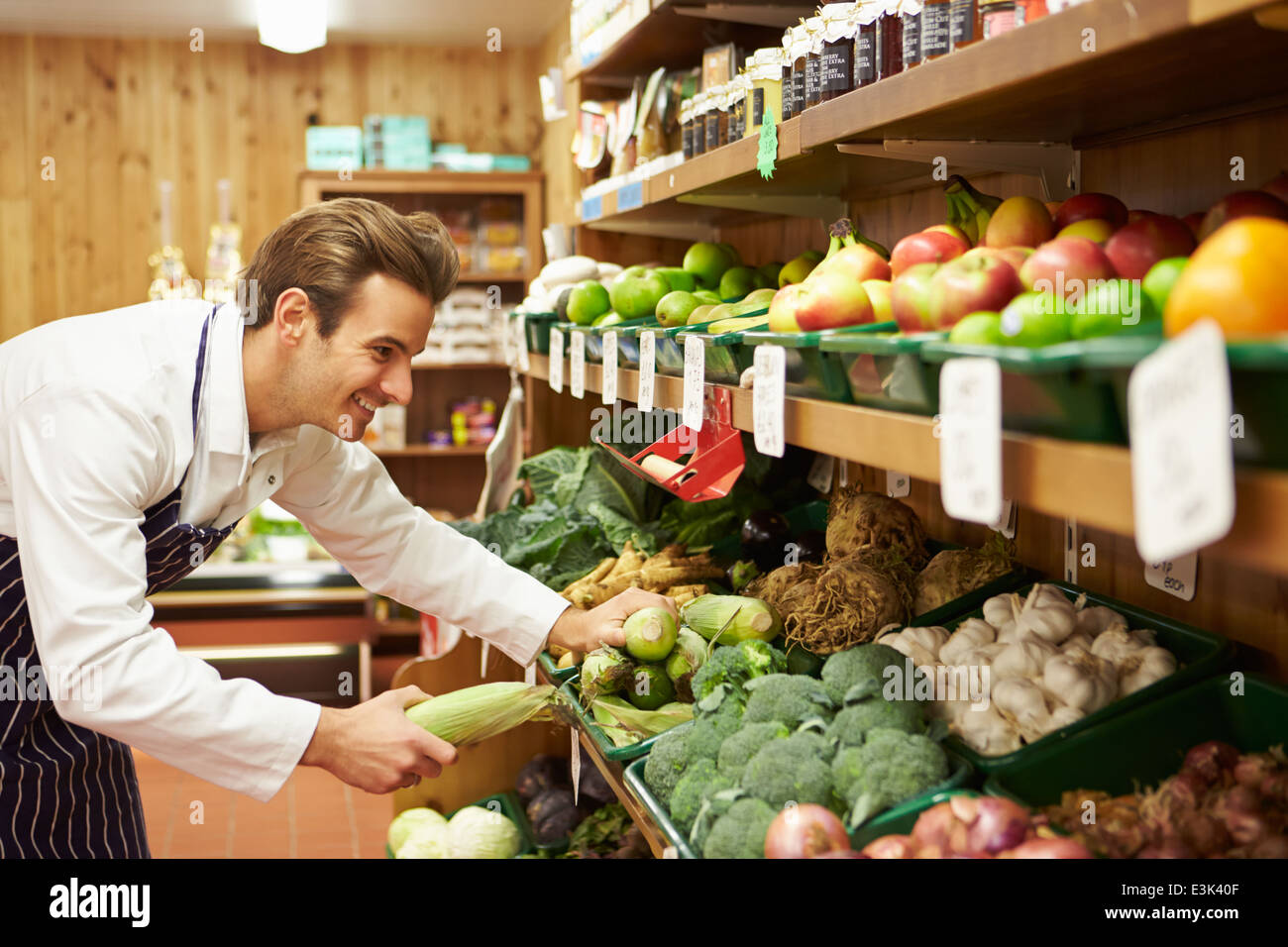 Male Sales Assistant At Vegetable Counter Of Farm Shop Stock Photo - Alamy