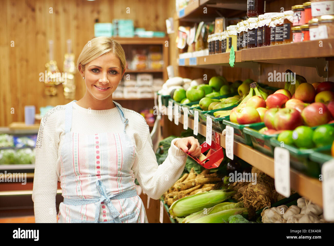 Female Sales Assistant At Vegetable Counter Of Farm Shop Stock Photo ...