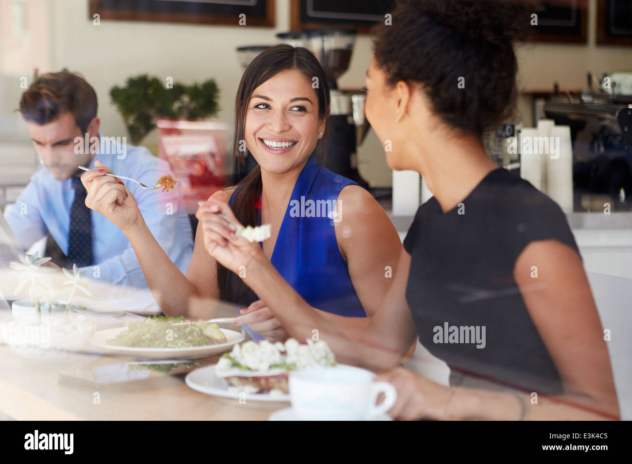 Two Businesswomen Meeting For Lunch In Coffee Shop Stock Photo - Alamy