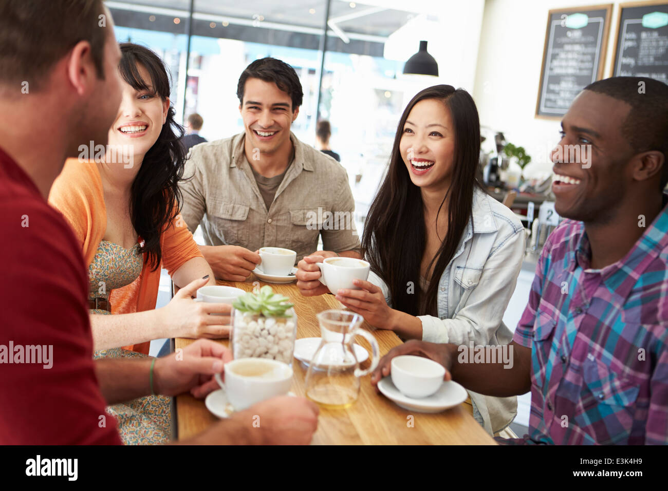 Group Of Friends Meeting In Coffee Shop Stock Photo - Alamy