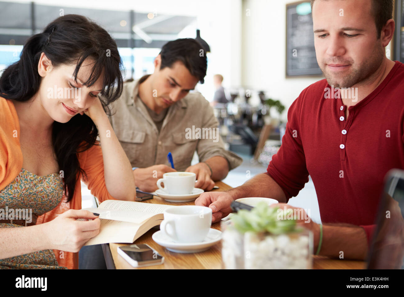 Customers In Busy Coffee Shop Stock Photo - Alamy