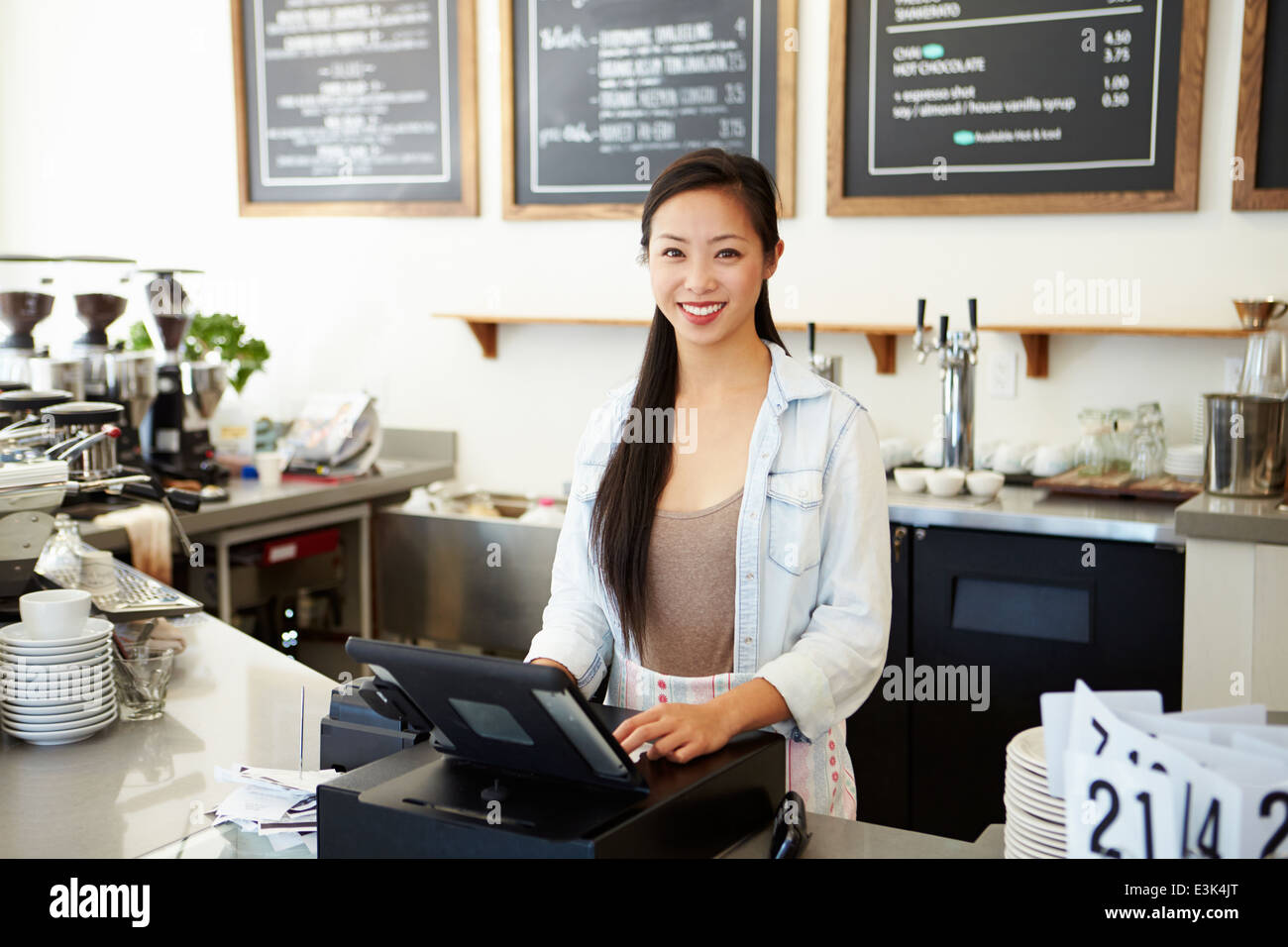 Asian cafe owner smiling hi-res stock photography and images - Alamy