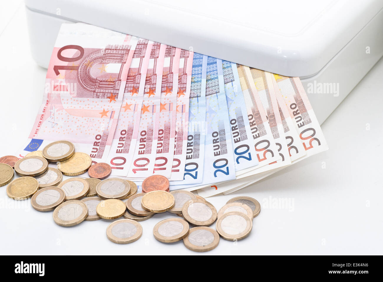 Euro bills and coins Stock Photo - Alamy