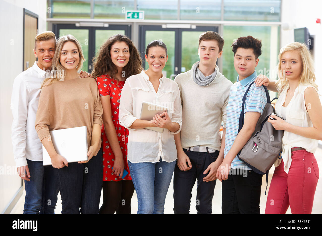 Portrait Of Female Tutor In Class With Students Stock Photo - Alamy