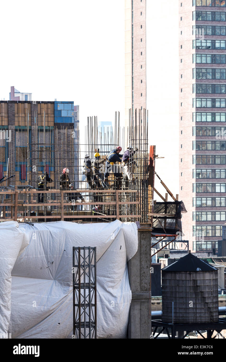 High-rise Building Construction Site with Tradesmen, NYC, USA Stock ...