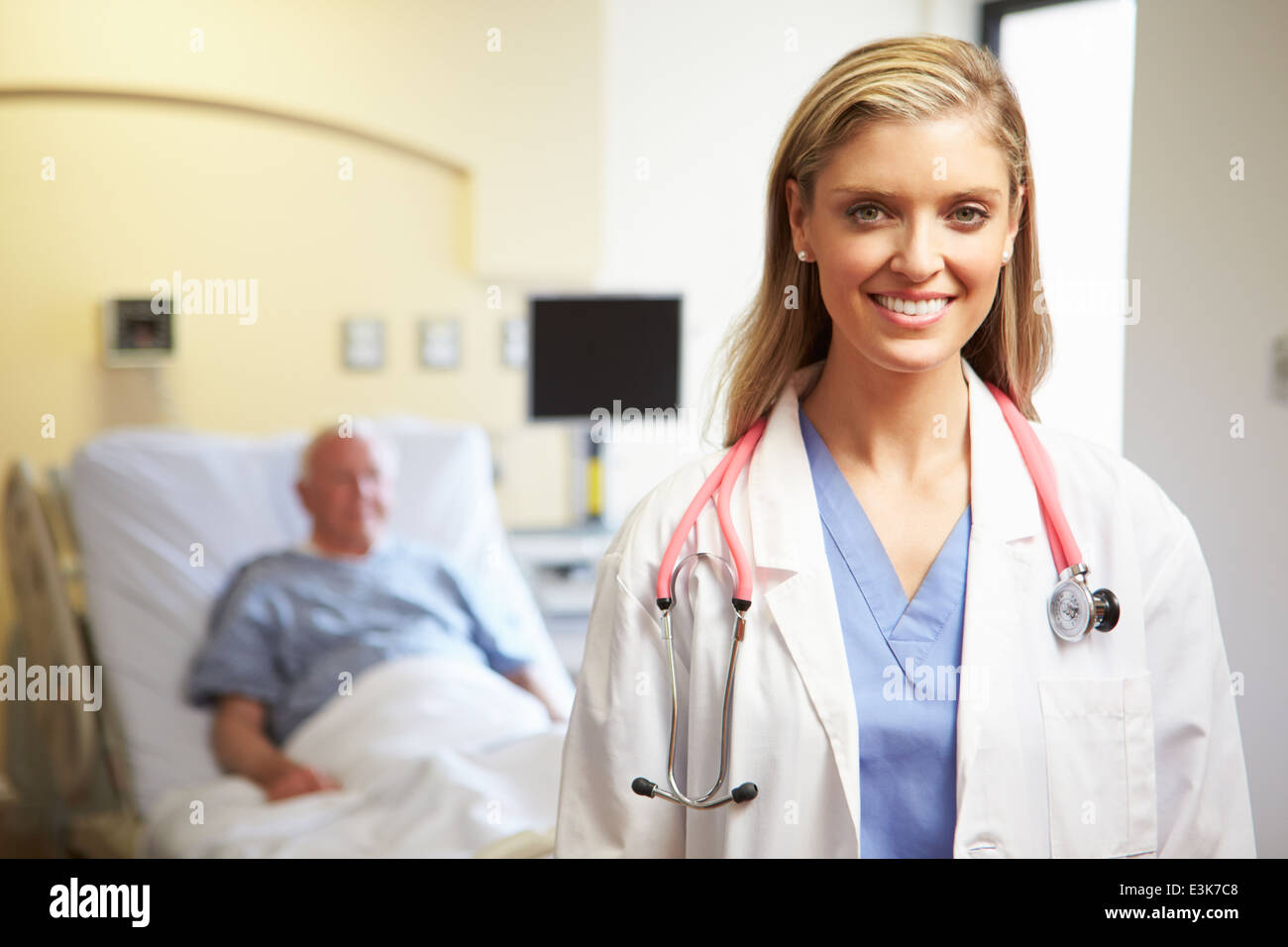 Portrait Of Female Doctor With Patient In Background Stock Photo - Alamy