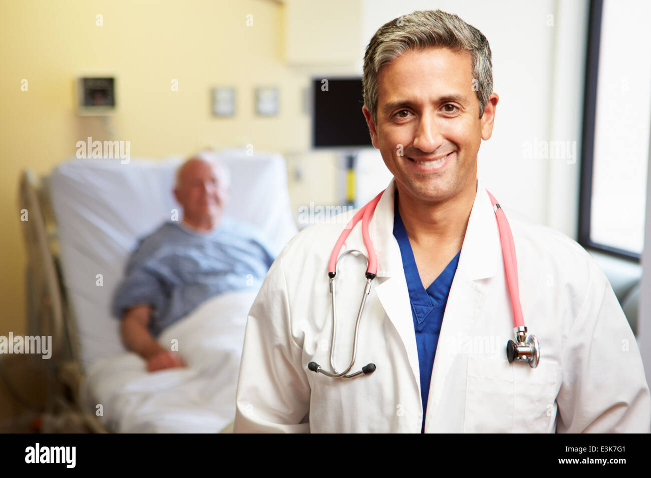 Portrait Of Male Doctor With Patient In Background Stock Photo - Alamy