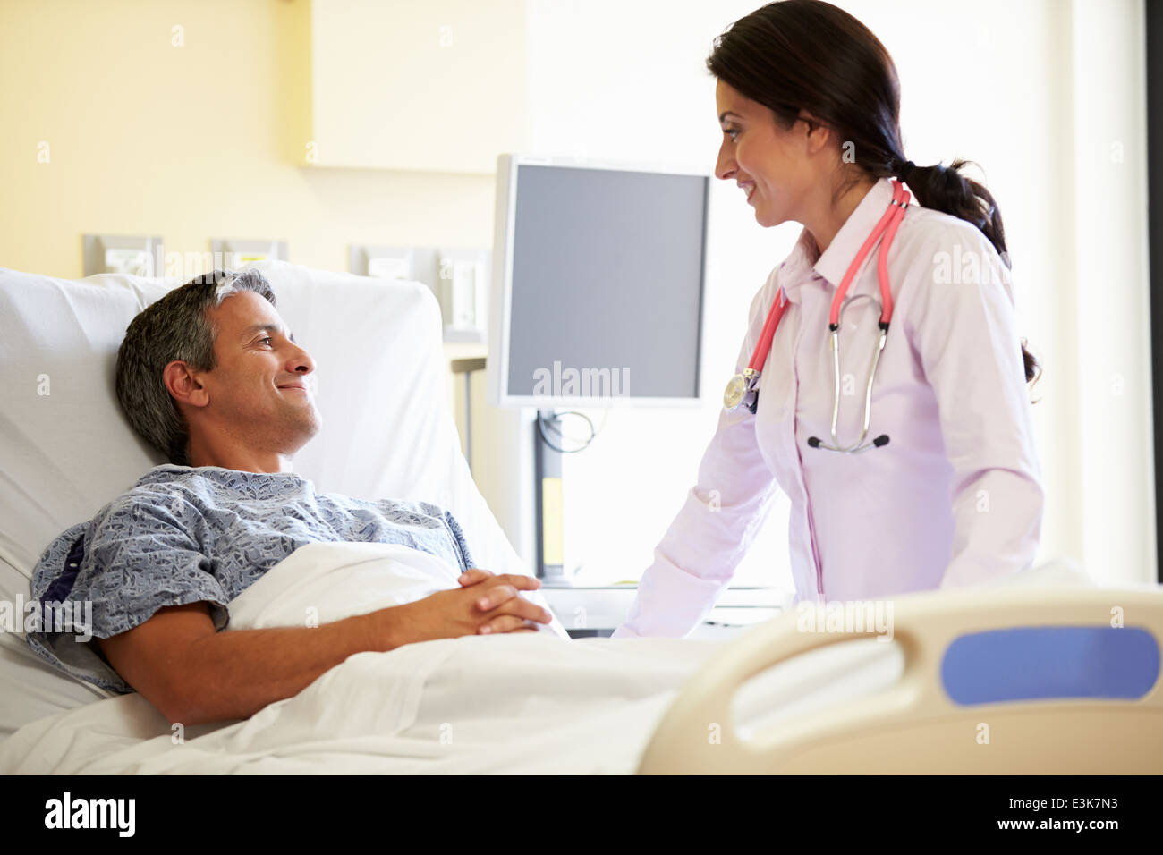 Female doctor talking male patient hi-res stock photography and images ...