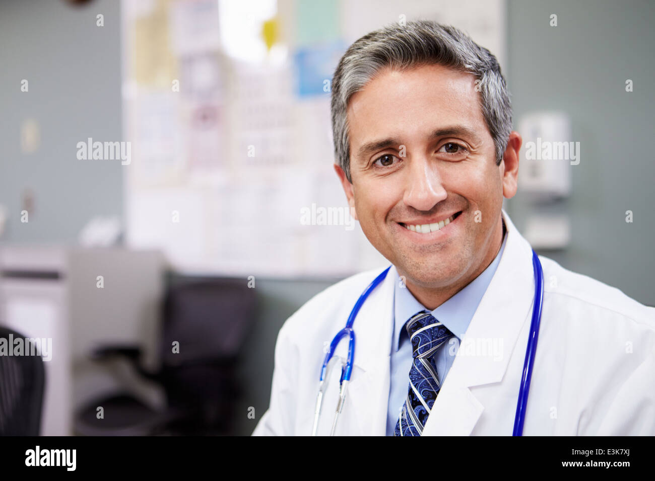 Portrait Of Doctor Working At Nurses Station Stock Photo - Alamy