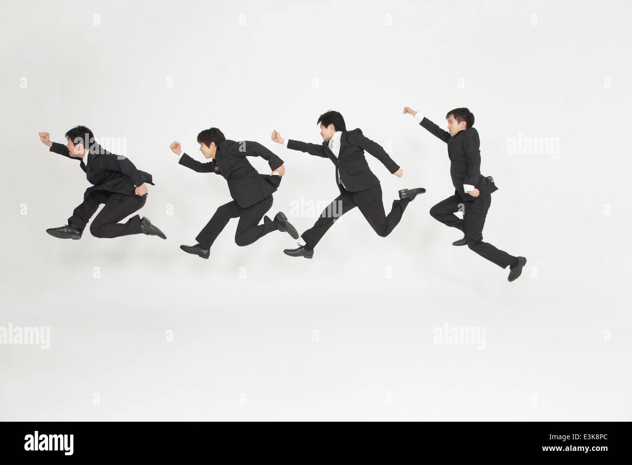 Japanese businessmen jumping Stock Photo - Alamy