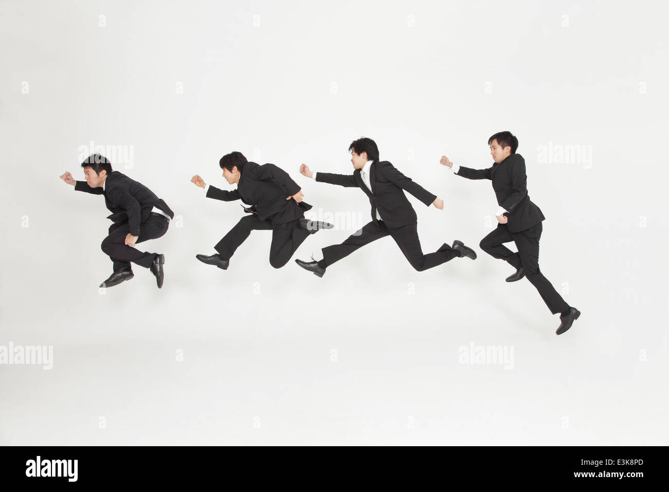 Japanese businessmen jumping Stock Photo - Alamy