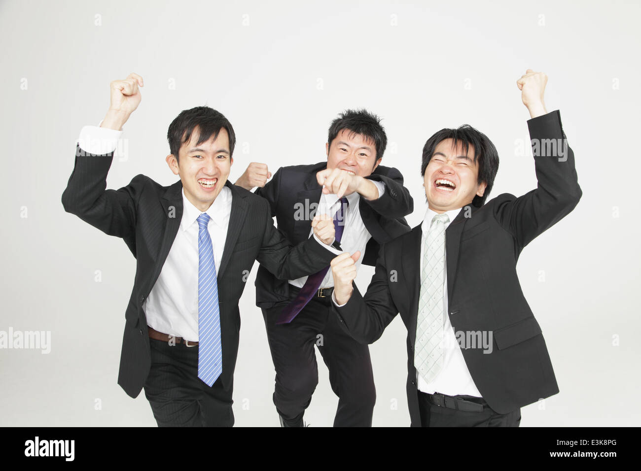 Japanese businessmen cheering Stock Photo - Alamy