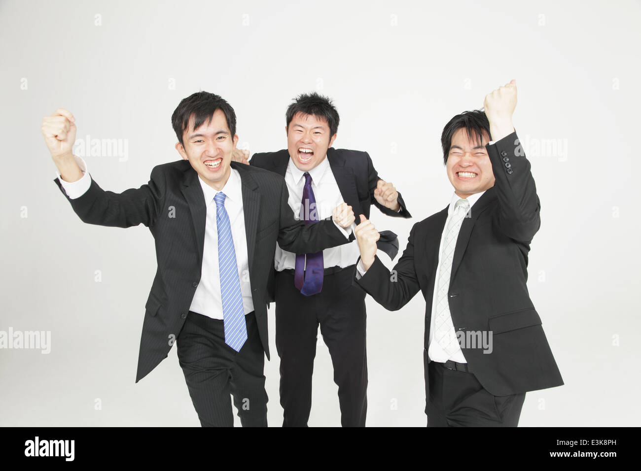 Japanese businessmen cheering Stock Photo - Alamy