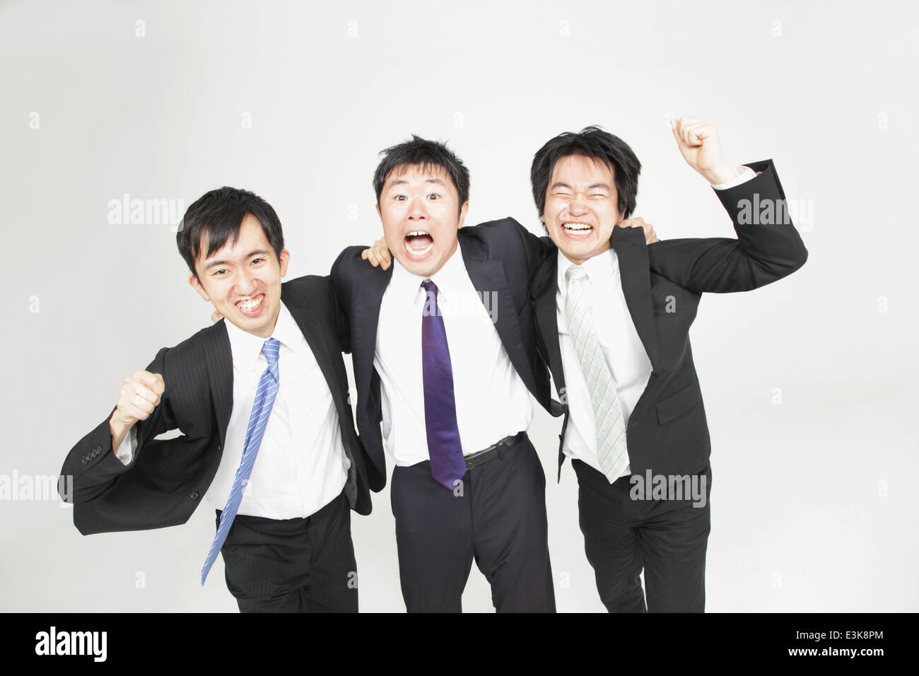 Japanese businessmen cheering Stock Photo - Alamy