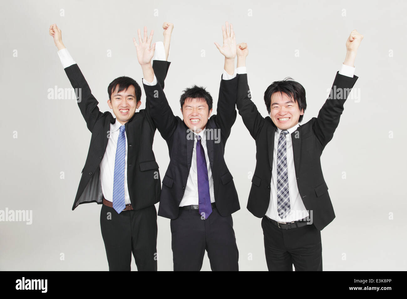 Japanese businessmen cheering Stock Photo - Alamy