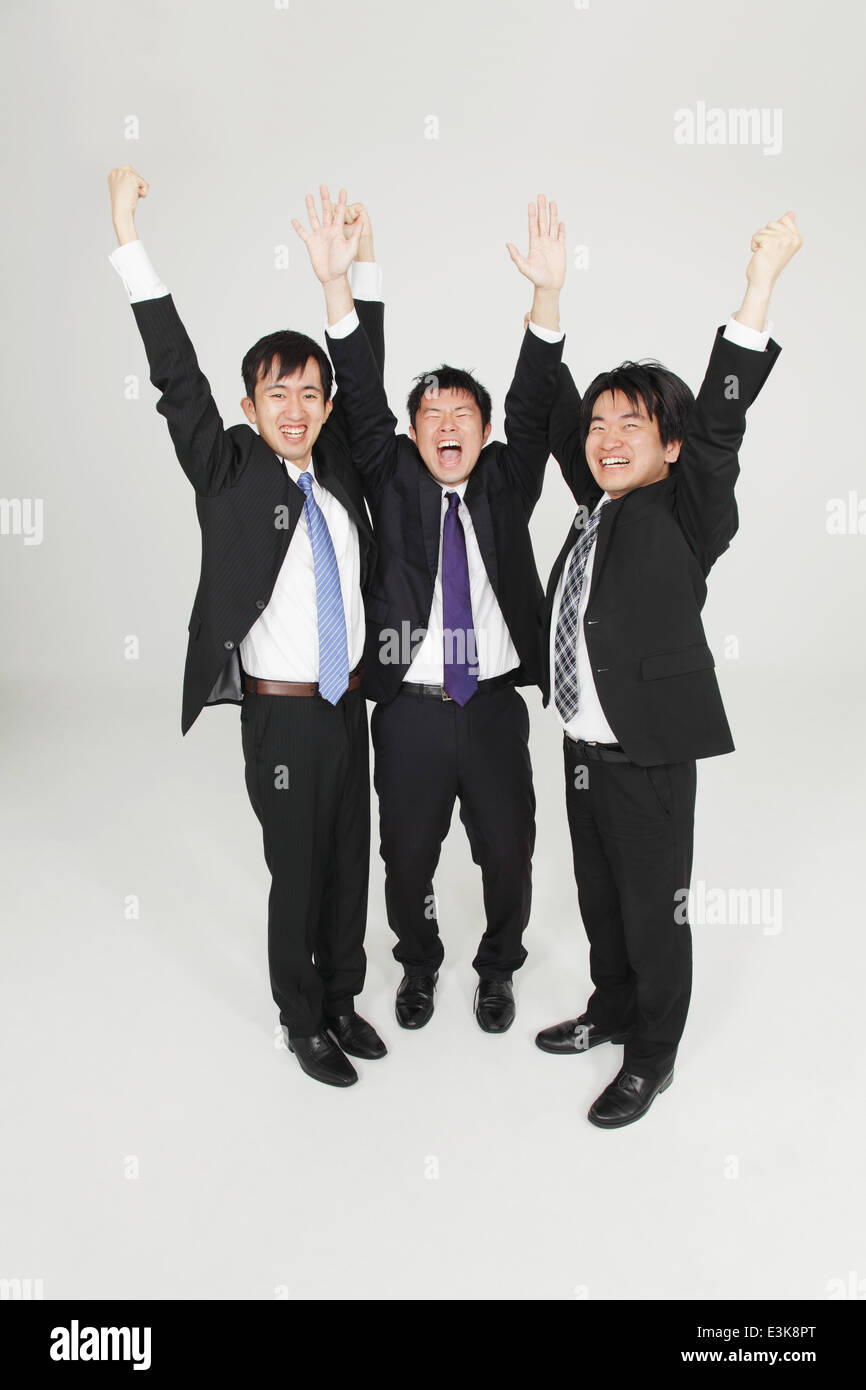 Japanese businessmen cheering Stock Photo - Alamy