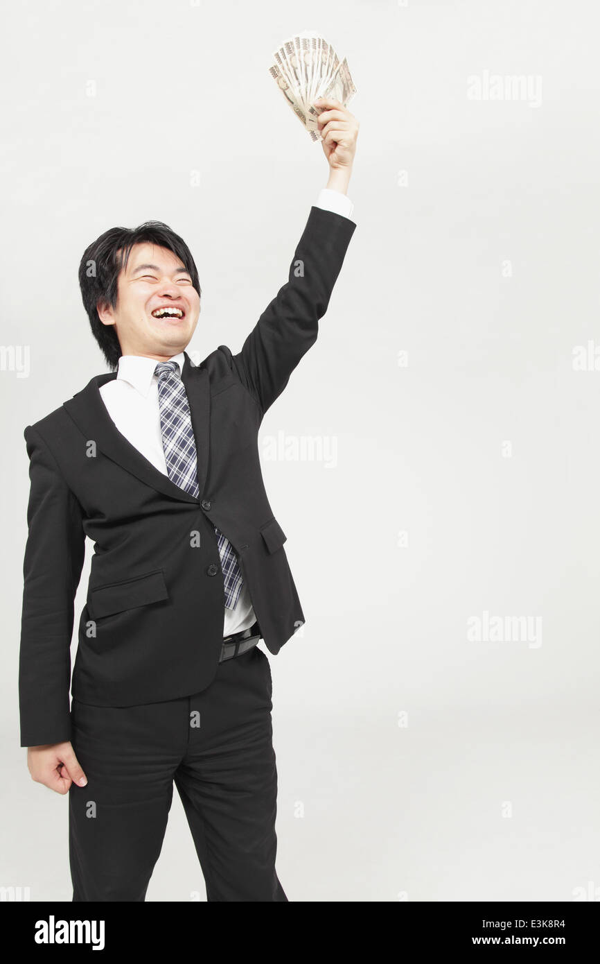 Japanese businessman with money Stock Photo - Alamy