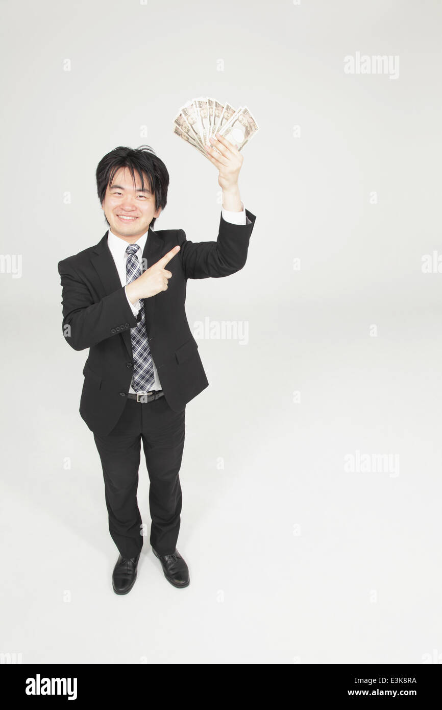 Japanese businessman with money Stock Photo - Alamy