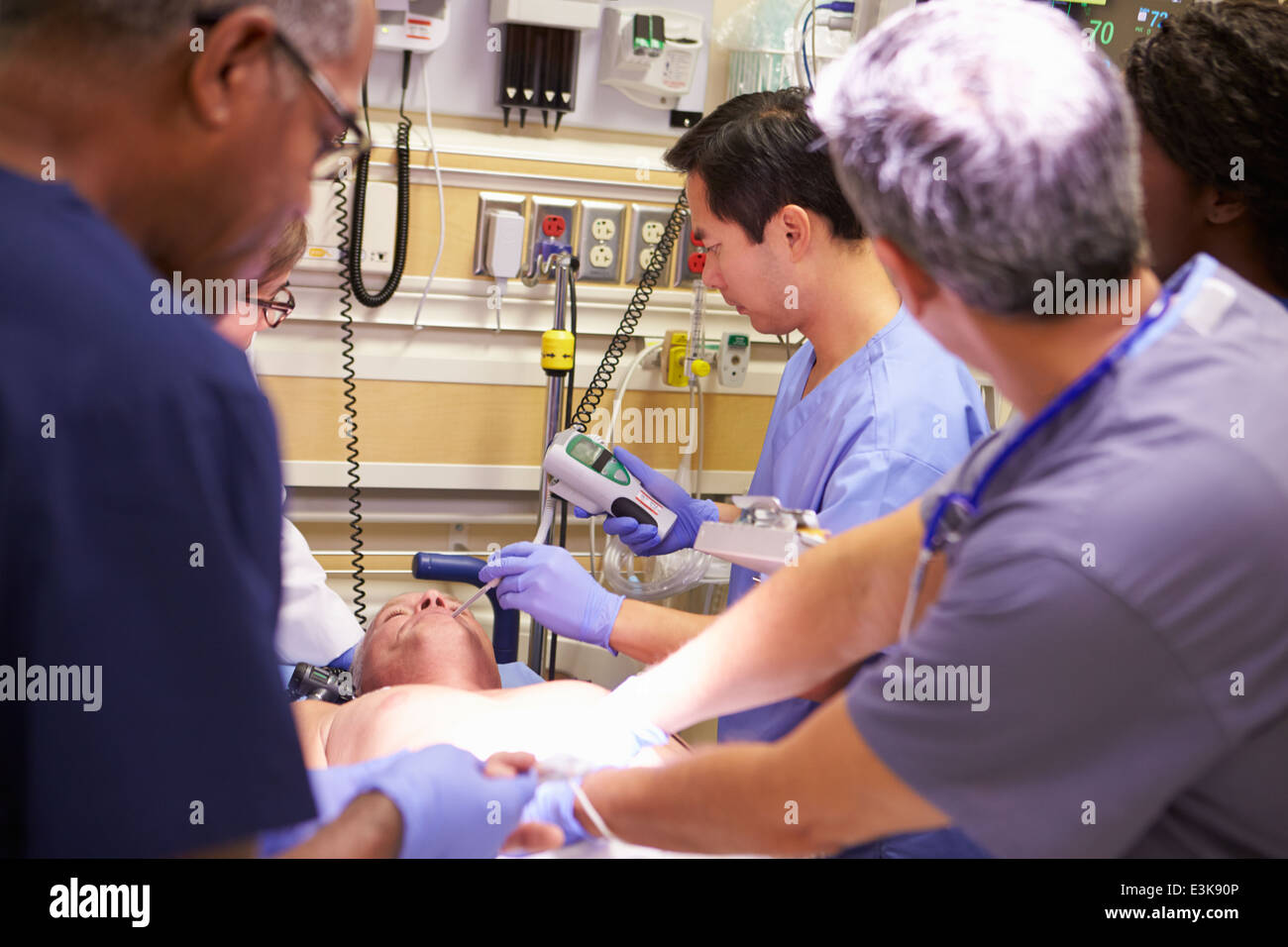 Medical Team Working On Patient In Emergency Room Stock Photo - Alamy