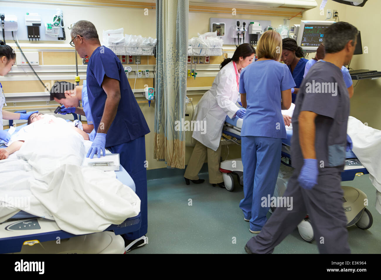 Medical Team Working On Patient In Emergency Room Stock Photo - Alamy