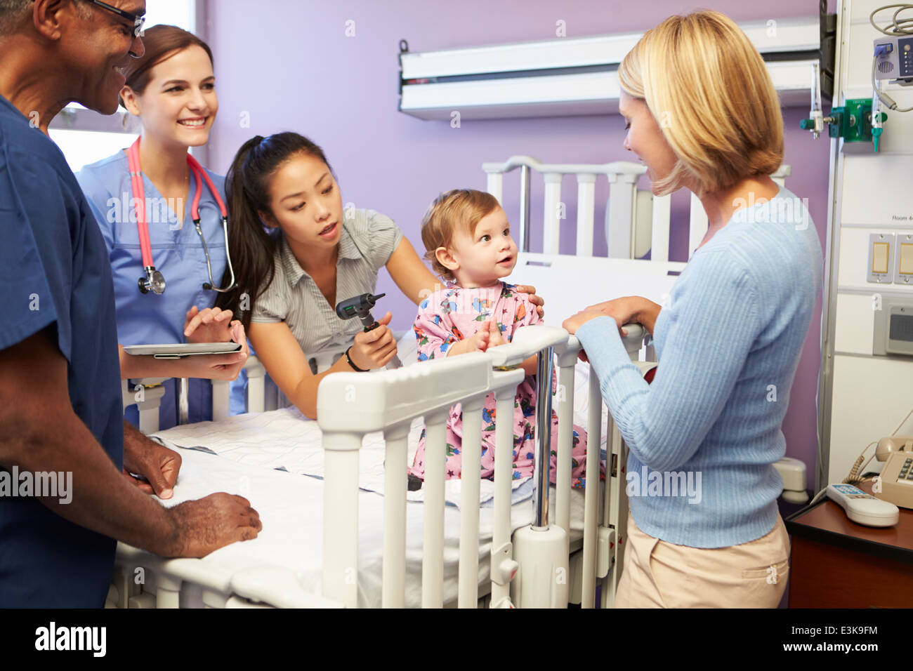 Mother And Daughter With Staff In Pediatric Ward Of Hospital Stock ...