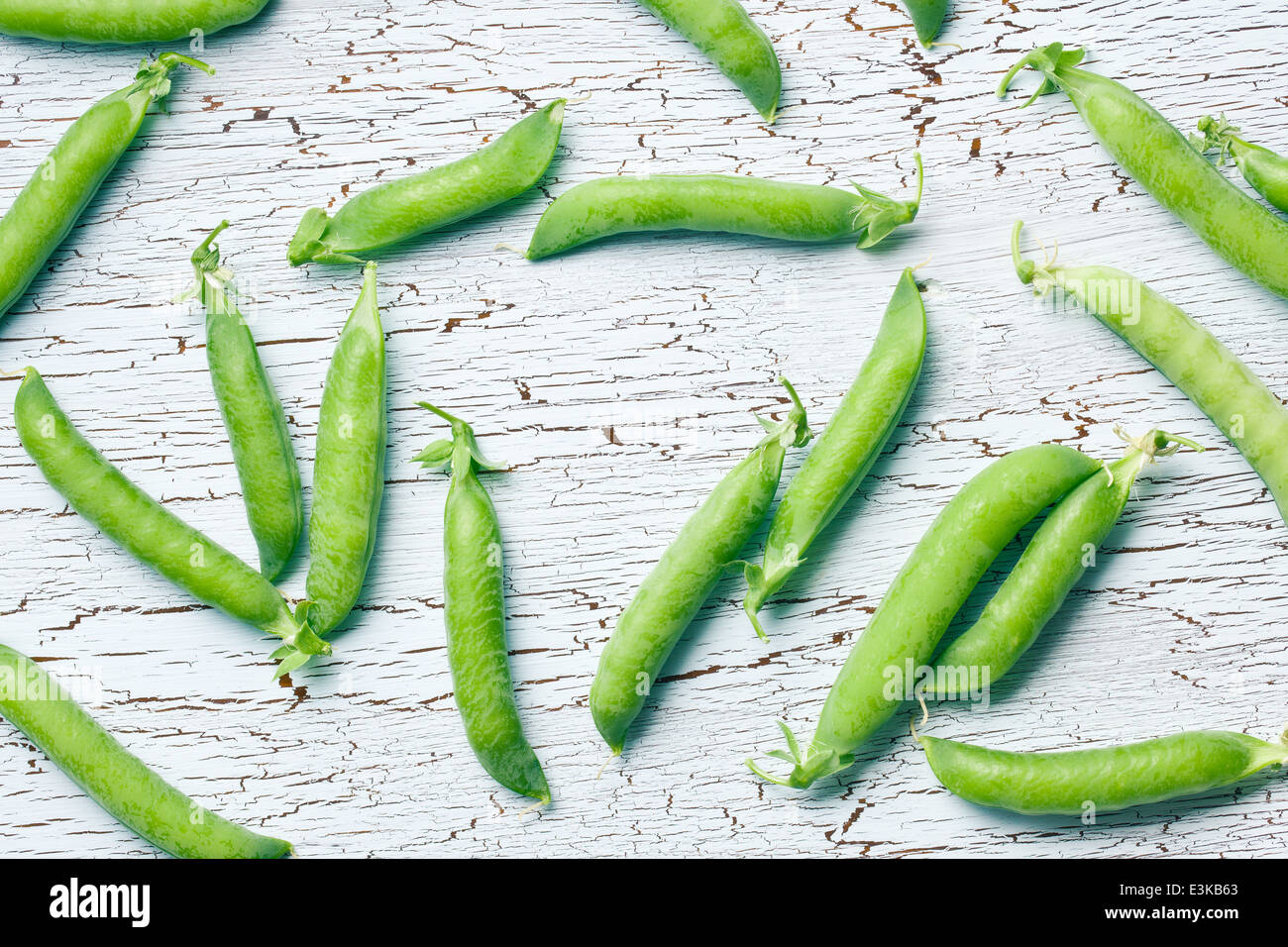 top view of green pea pods on old cracked background Stock Photo - Alamy