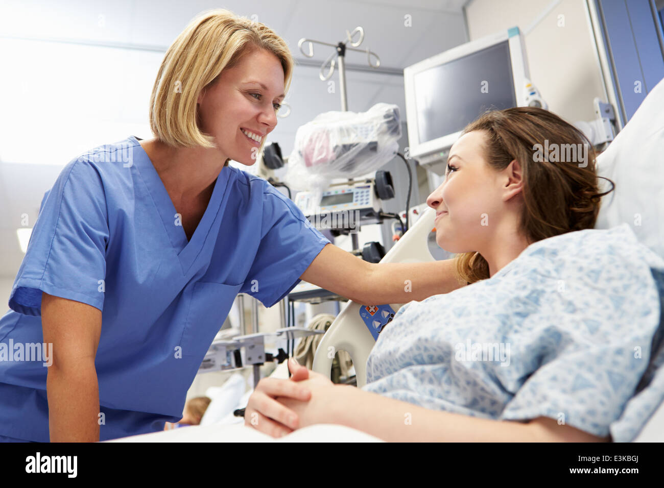 Young Female Patient Talking To Nurse In Emergency Room Stock Photo - Alamy