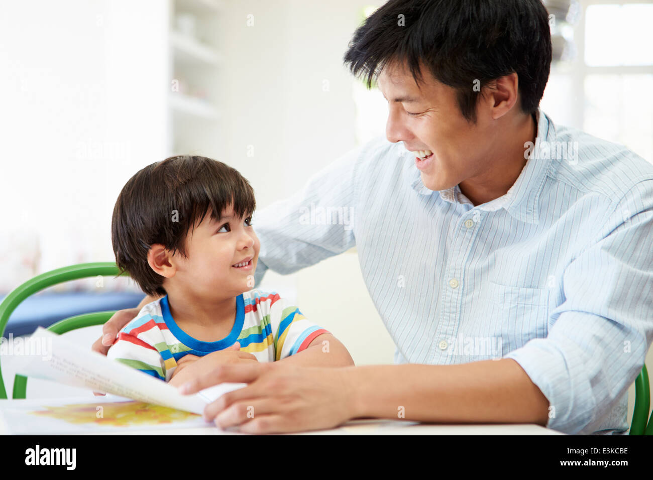 Helping his son to do homework hi-res stock photography and images - Alamy