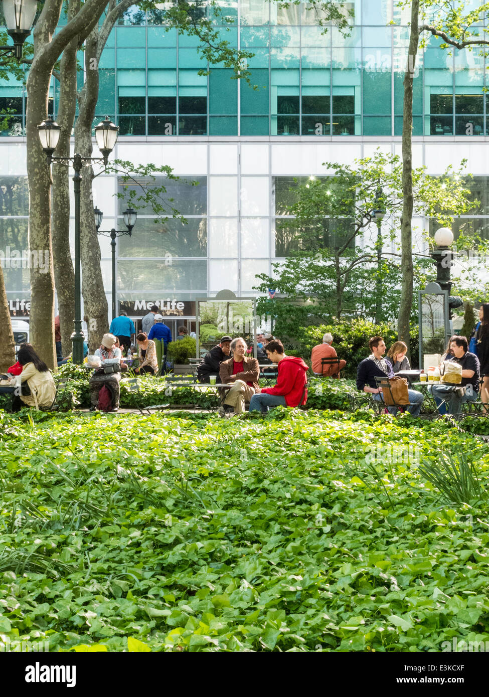 People Enjoying a Spring Day in Bryant Park, NYC Stock Photo - Alamy